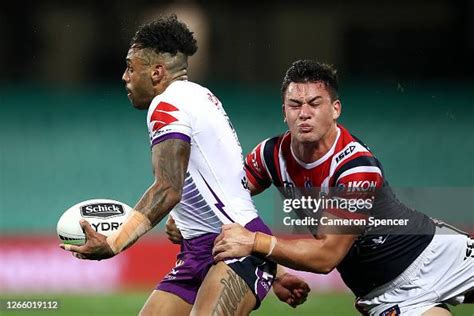 Josh Addo Carr Of The Storm Is Tackled By Joseph Manu Of The Roosters