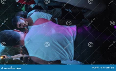Fans Dancing Mosh Pit And Raising Their Hands At A Concert Or Festival Party Stock Footage