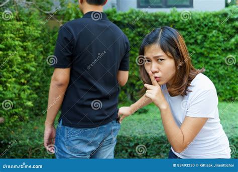Female Pickpocket Stealing A Wallet From Behind Pocket On Jeans Stock