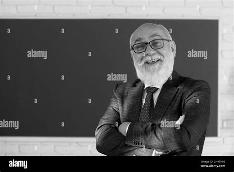 Funny Senior Professor Portrait Of Happy Senior Teacher With Arms