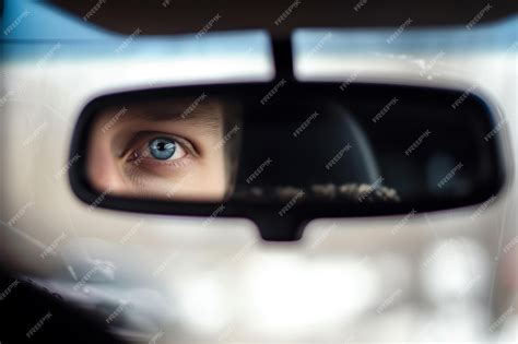 Premium Photo Closeup Of A Drivers Eyes Reflected In The Rearview Mirror
