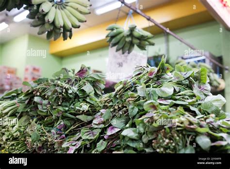 Green Chinese Vegetables And Bananas For Sale At A Vietnamese Grocer In