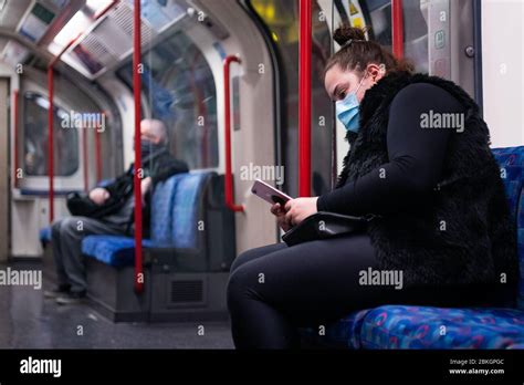Members Of The Public Stay Socially Distant On The Central Line As The