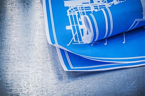 Premium Photo Blue Blueprints On Scratched Metallic Background