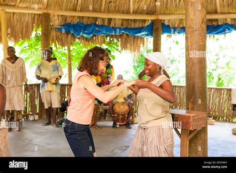 Tourist Dances With Garifuna Woman At Yubu Garifuna Experience Roatan