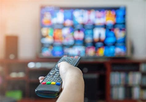 The Man Pressing Button On TV Remote Control Stock Photo Image Of