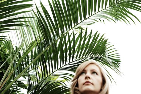 Premium Photo Beautiful Woman Against Palm Trees
