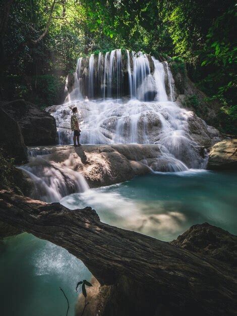 Premium Photo Solo Traveler Enjoy Scenic Waterfall Turquoise Pond In