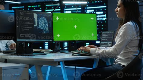 Technician Doing Checkup On Green Screen Server Hub Pc To Optimize It