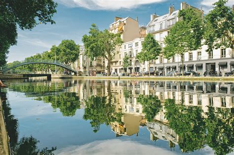 Canal Saint Martin Walk The Shores Of A Scenic Canal Through A