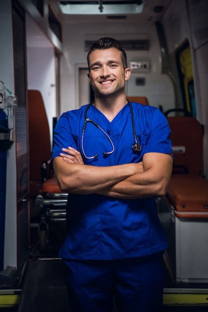 Premium Photo A Portrait Of A Young Handsome Paramedic With A Toothy Smile
