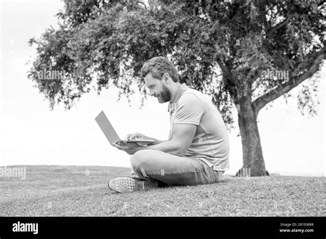 Freelance Man Post Blog Online Sit On Grass Writing Online