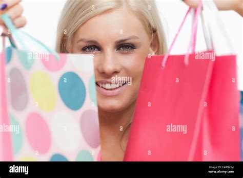 Smiling Blonde Showing Her Shopping Bags Stock Photo Alamy