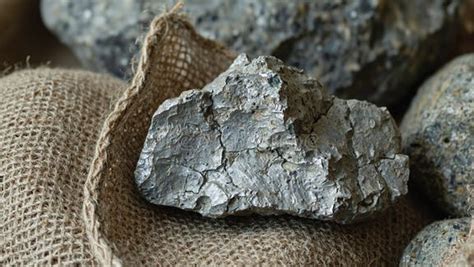 Raw Tin Ore On Burlap Sack With Other Mined Rocks Stock Illustration