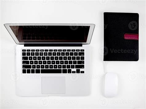 Top View Of Laptop Computer With Open Display Screen Monitor Mouse And Book Isolated On White