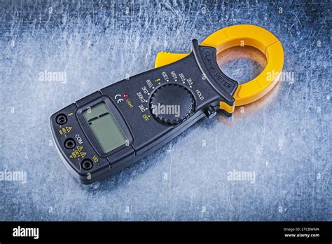 Digital Clamp Meter On Metallic Background Electricity Concept Stock