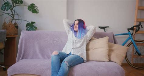 Happy Latin Hispanic Teenager School Girl Sits Down On Sofa Cozy Home