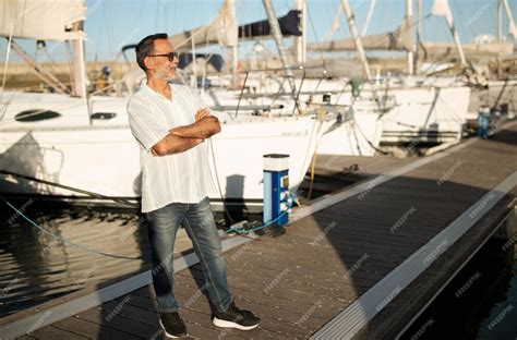 Premium Photo Dream Sea Holidays Mature Gentleman With Hands Crossed