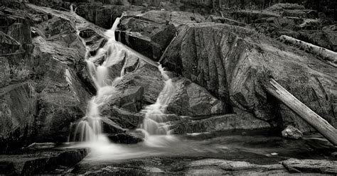 Falls And Logs Photograph By Eric Bjerke Sr Fine Art America