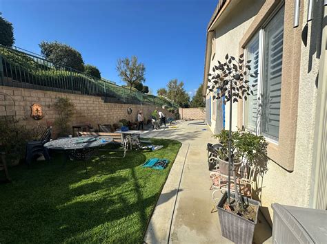 Complete Backyard Remodel In Simi Valley Ca Pavers Grass Planter Wall And Lighting Green