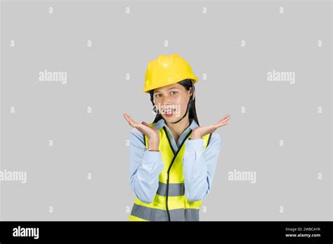 Female Indian Nepali Asian Construction Worker And Engineer Giving