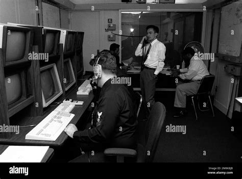 A Japanese Naval Officer Mans The Telephone To Relay Information At One