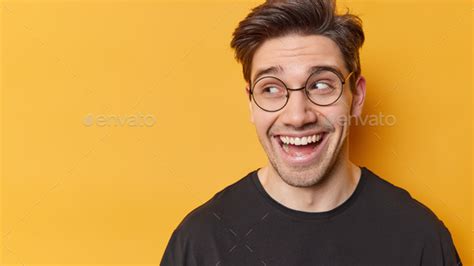 Positive Smiling Guy Looks Away Laughs At Something Funny Smiles