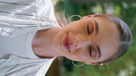 Portrait Of Beautiful Young Woman Smiling Camera Scrolling Smartphone