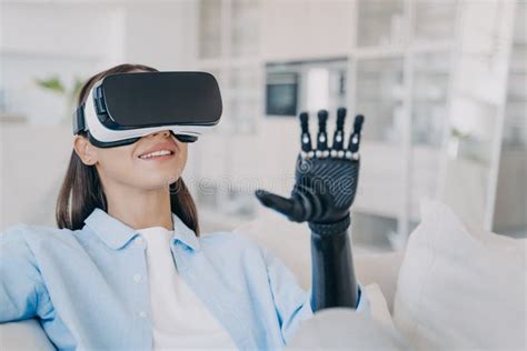 Girl In Vr Glasses Interacts With Virtual Reality By Prosthetic Arm