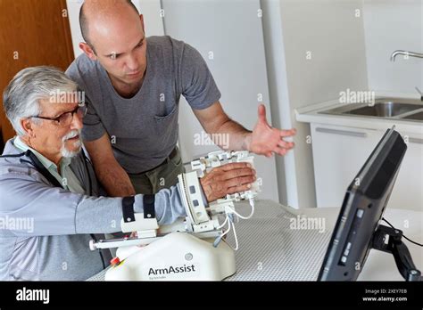 patient with assistive robot for upper limb rehabilitation the robot
