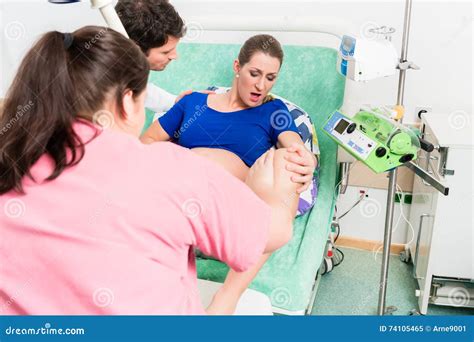 Woman Giving Birth In Labor Room Of Hospital Royalty Free Stock