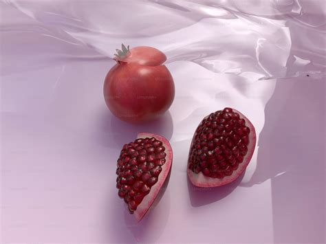 석류와 석류 반 사진 Unsplash의 벽지 이미지