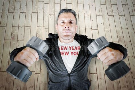 Man Lying On Floor While Holding Two Barbells Stock Image Image Of