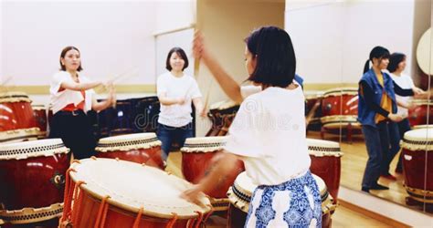 Japanese Drums Teacher Or People In Class For Music On Instrument For