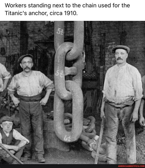 Workers Standing Next To The Chain Used For The Titanics Anchor Circa