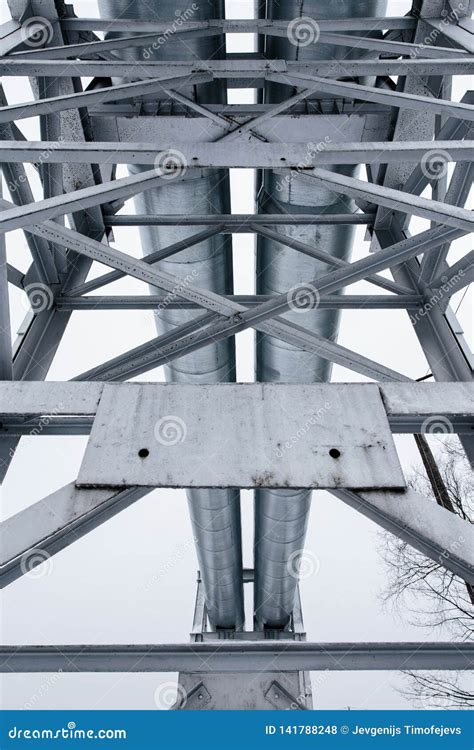 Huge Gas Pipeline Laid Along Snowy Street In Riga Latvia Stock Photo