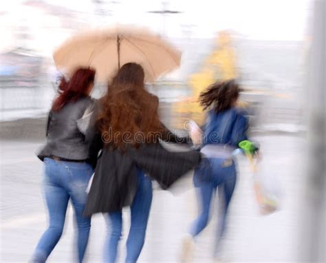 People With Umbrella Walking Down The Street In Rainy Day Stock Image