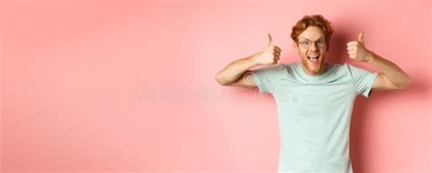 Amazed Redhead Guy Scream With Joy And Looking Impressed And Excited