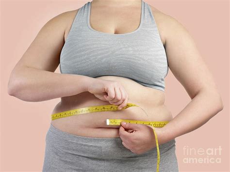 Overweight Woman Measuring Waist Photograph By Science Photo Library