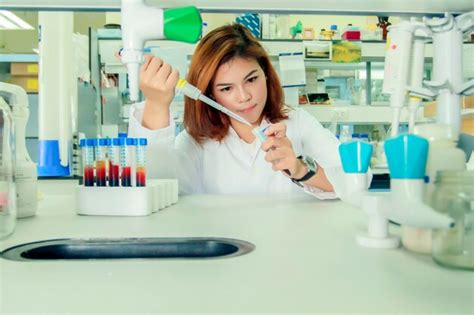 Premium Photo Close Up Of Scientist Performing Experiment At Laboratory