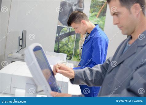 Man Entering Information Into Electronic Control Pad Stock Image