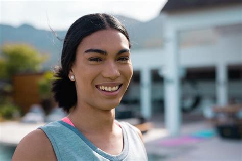 Premium Photo Portrait Of Happy Biracial Woman Smiling In Garden