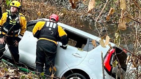 Woman Rescued From Vehicle In Precarious Position On Rock Creek