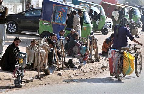 Labourers Waiting For Their Daily Job While Sitting At Roadside Setup