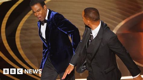 Will Smith Hits Chris Rock On Oscars Stage