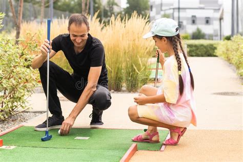 Closeup Of Player Play Mini Golf With Ball Stock Image Image Of Golf Club 255227397