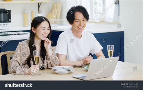 Couples Drinking Alcohol While Looking Computer Stock Photo 2037254408 Shutterstock