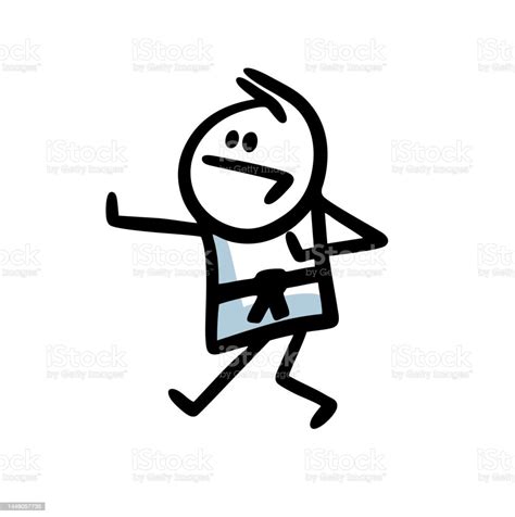 A Young Karate Athlete Stands In A Pose And Does An Exercise Stock