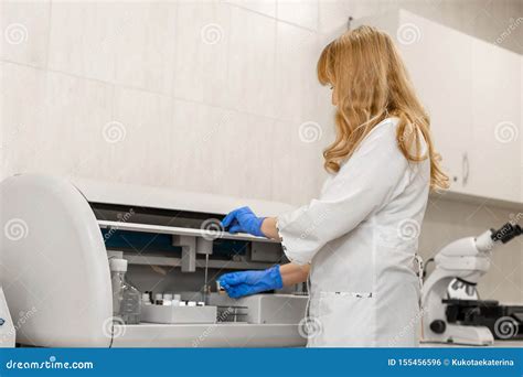 Laboratory Technician Test Blood In Automatic Blood Sample Analyzer