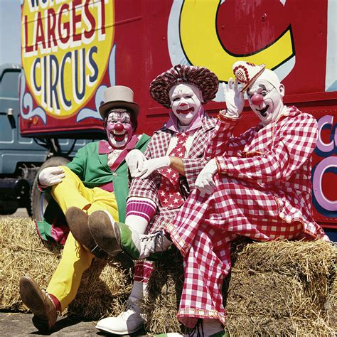 1970s Three Laughing Clowns Sitting Photograph By Vintage Images